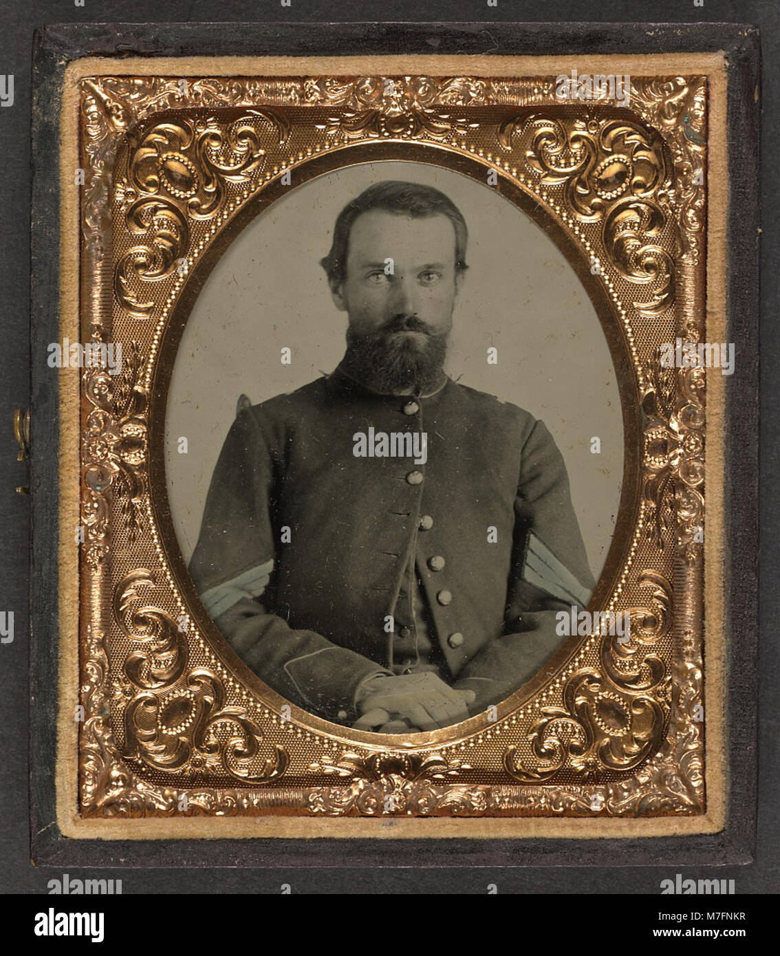 This image shows an unidentified soldier in a Union sergeant's uniform ...