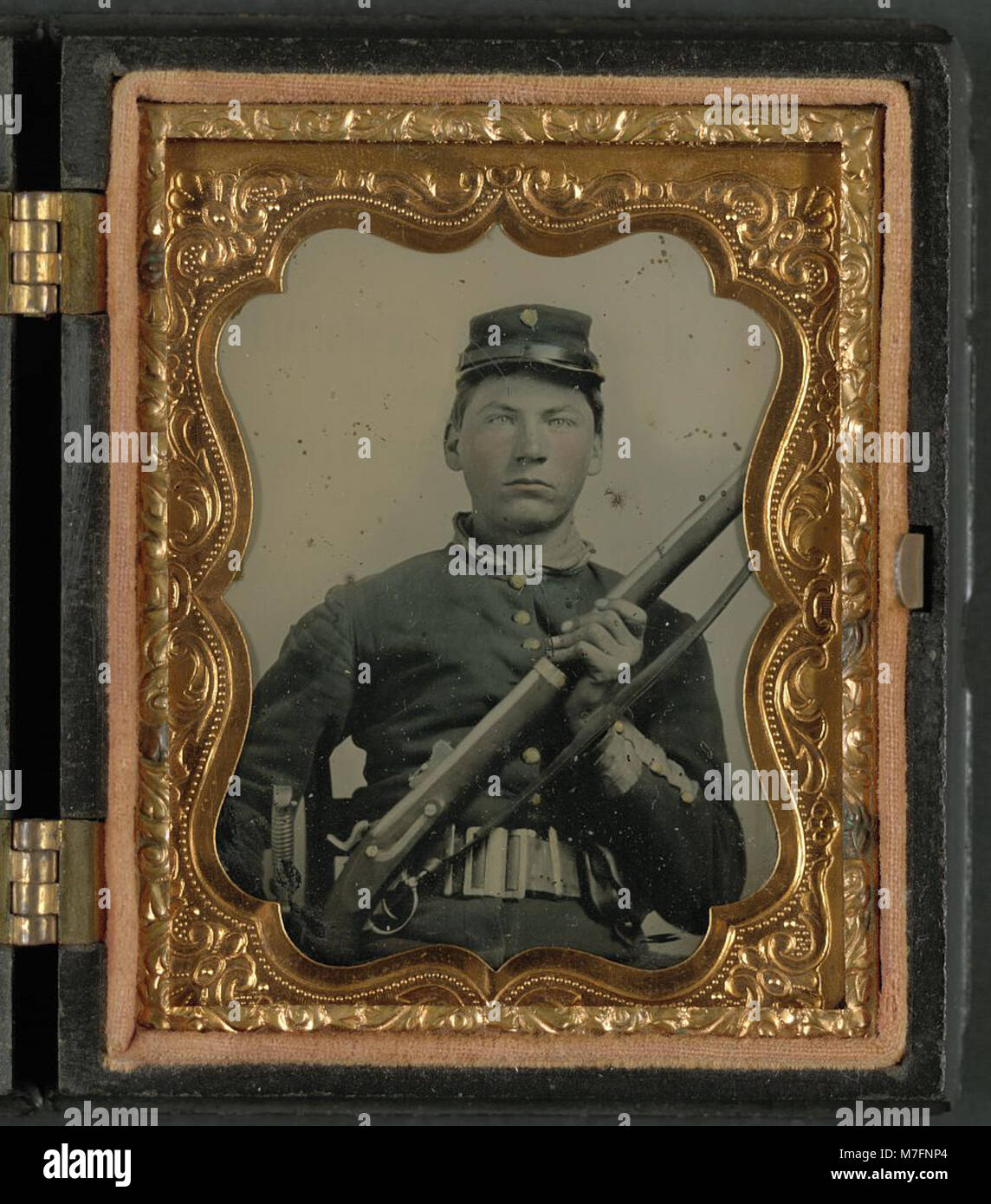 An unidentified Union soldier is shown wearing a uniform with a ...