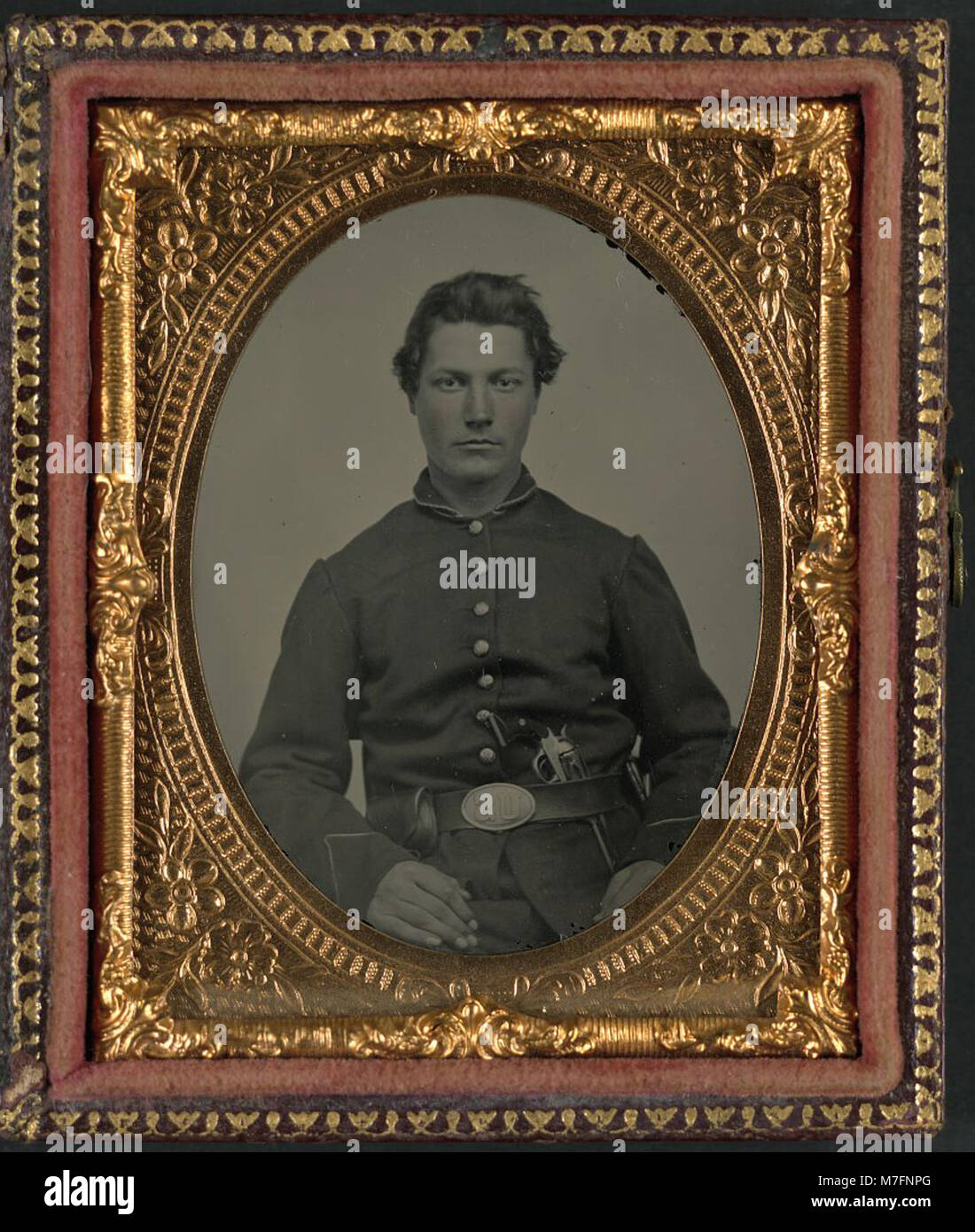 This image depicts an unidentified Union soldier wearing a U.S. belt ...