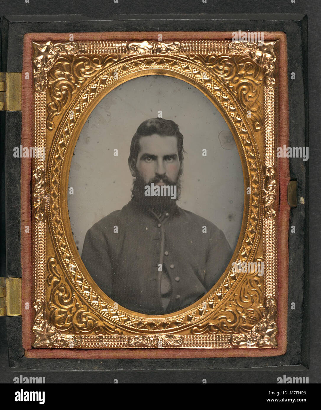 This photograph shows an unidentified soldier wearing a Union Army ...