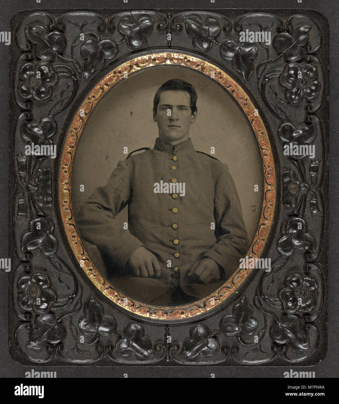 This photograph depicts an unidentified soldier wearing a Union uniform ...