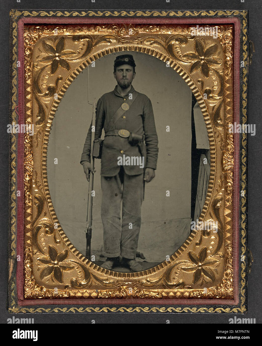 An unidentified soldier in Union uniform is shown holding a bayoneted ...