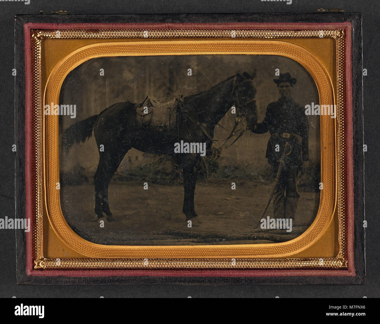 This photograph shows an unidentified Union soldier, dressed in a ...