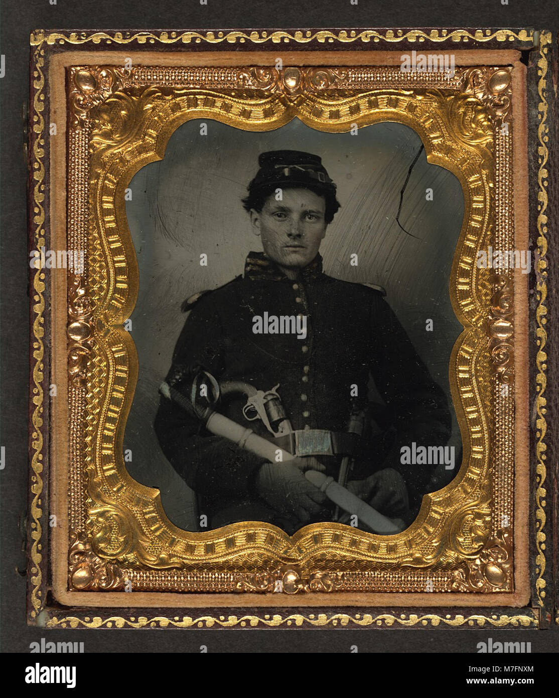A photograph of an unidentified Union soldier, equipped with dual ...