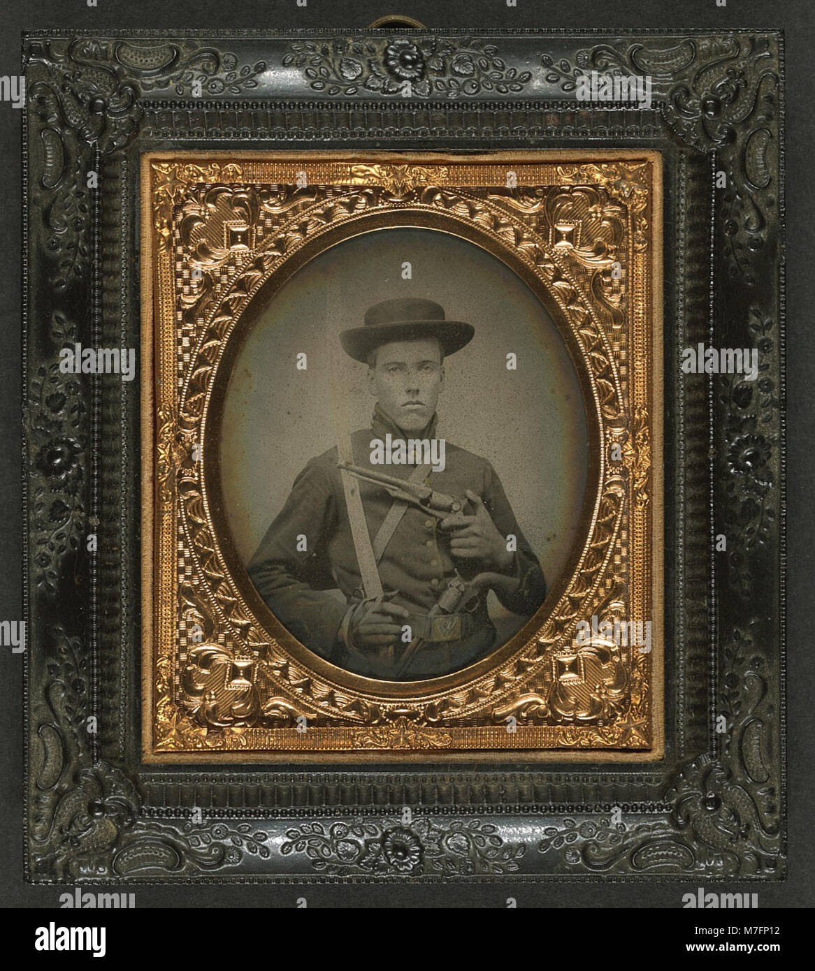 This image portrays an unidentified Union soldier, dressed in full ...