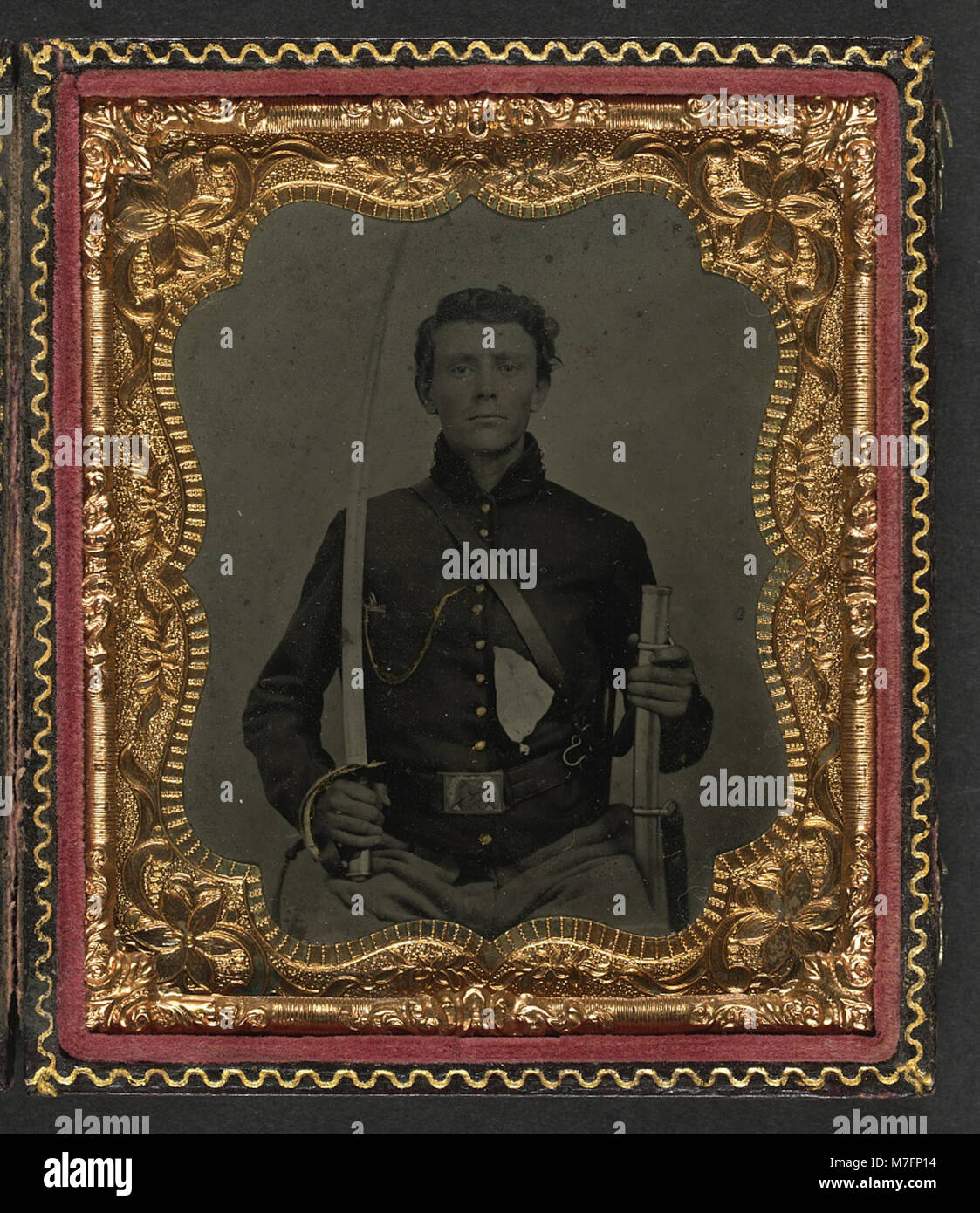 A photograph of an unidentified soldier wearing a Union uniform and ...