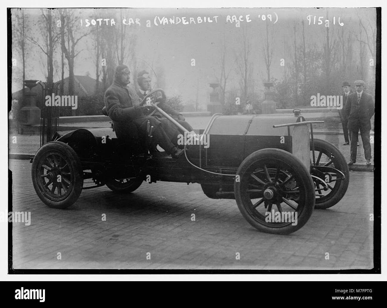 A photograph of the Vanderbilt Auto Race featuring an Isotta car, a ...