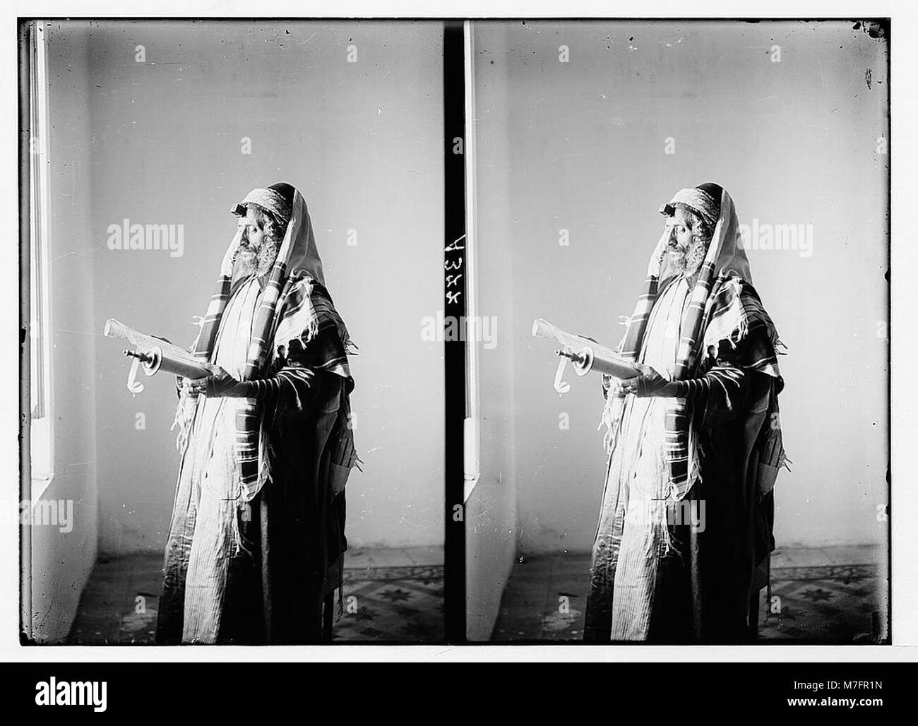 This image depicts a Jewish individual dressed in traditional attire ...