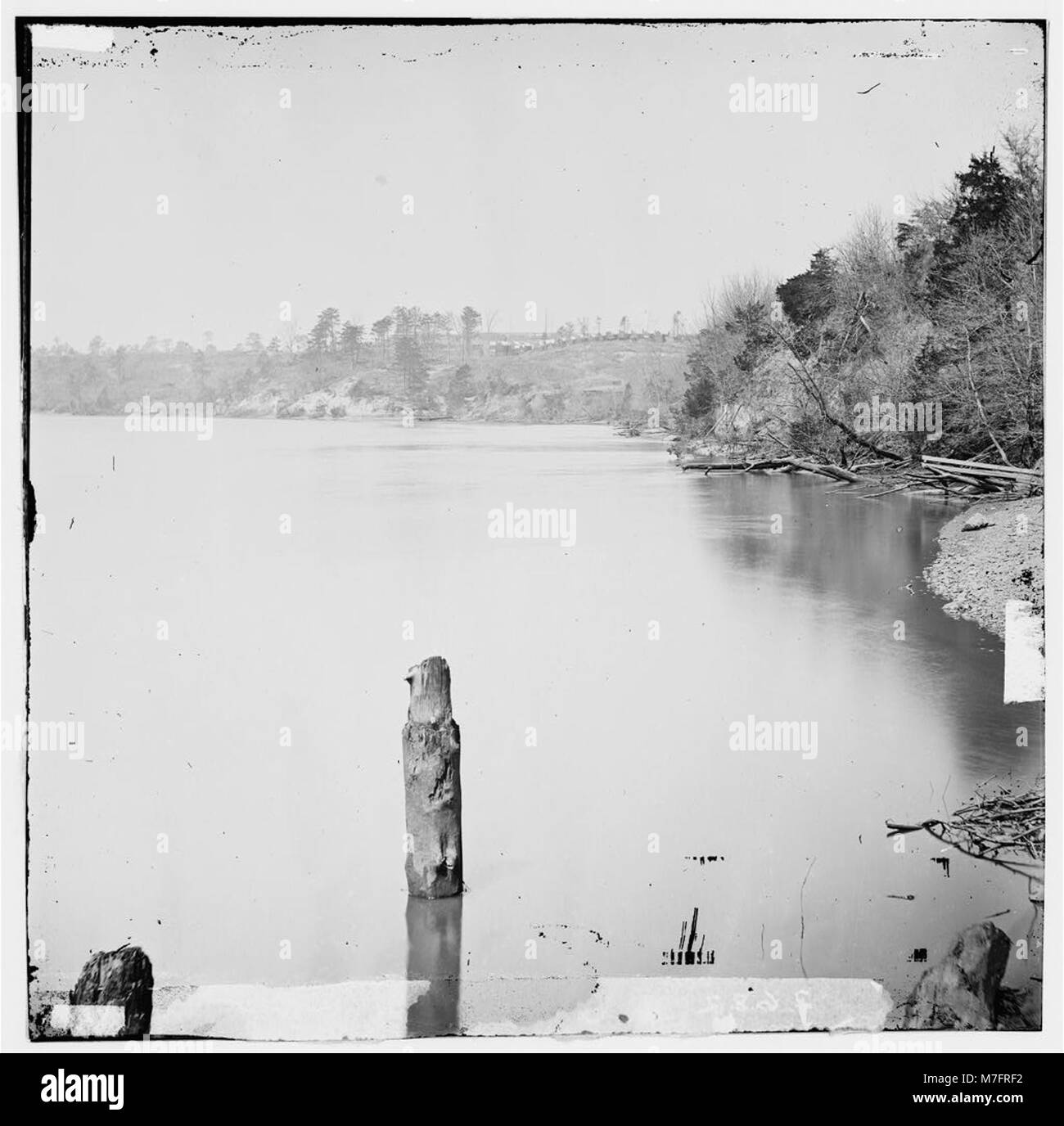 A scenic view of a riverbank, highlighting the natural landscape along ...