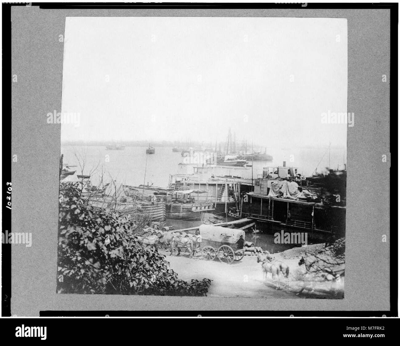 A historical view of City Point, Virginia, featuring barges and ...