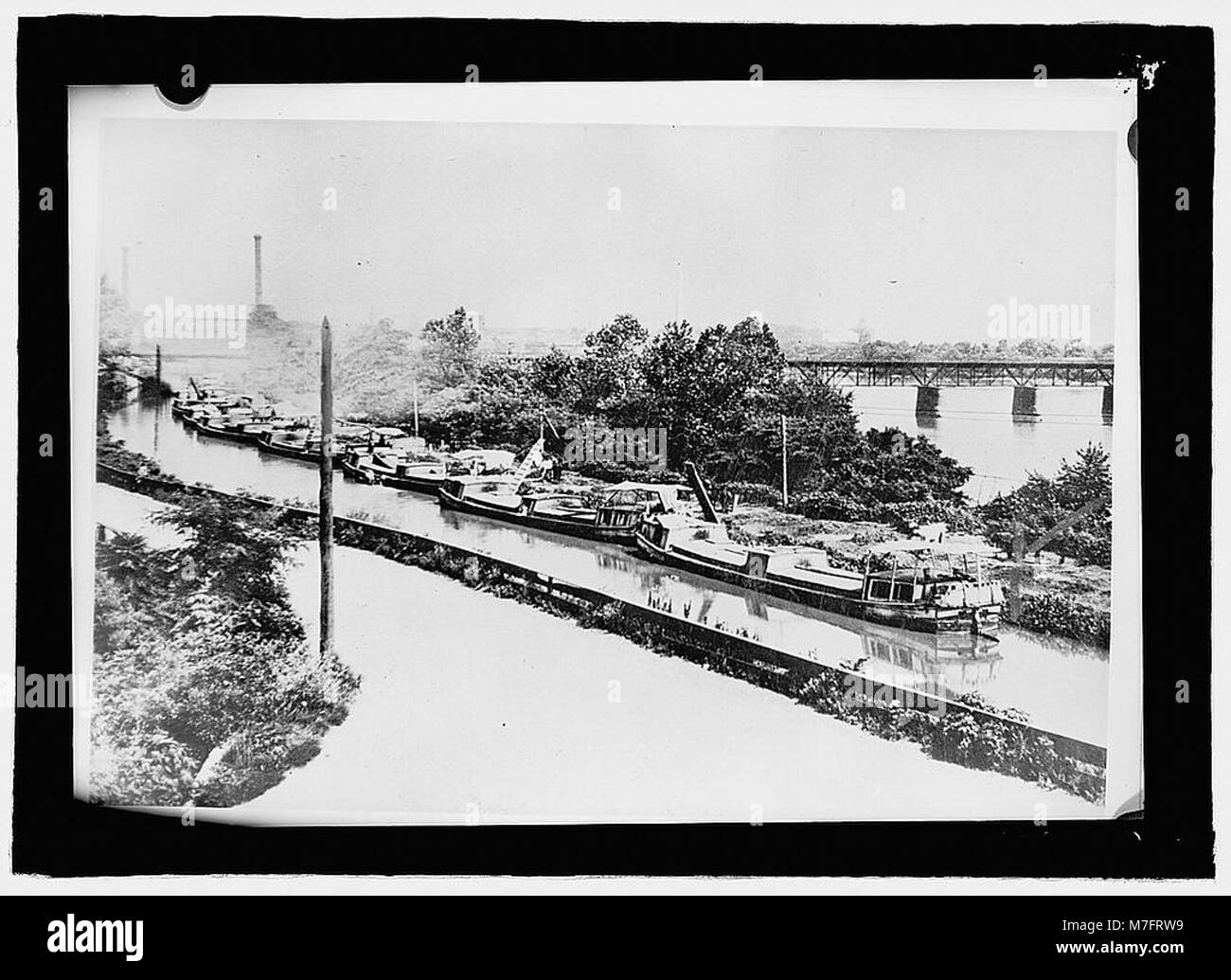 A photograph showing a view of a canal, capturing the waterway ...