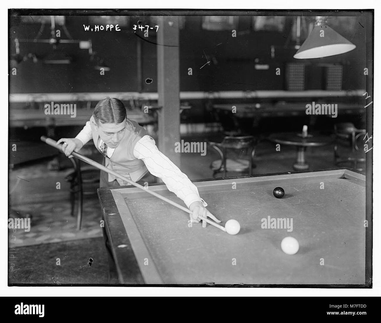 This image depicts W. Hoppe, a renowned billiards player, in the act of ...