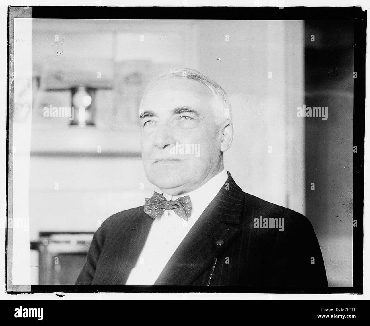 Warren G. Harding is captured in this portrait, presenting his ...