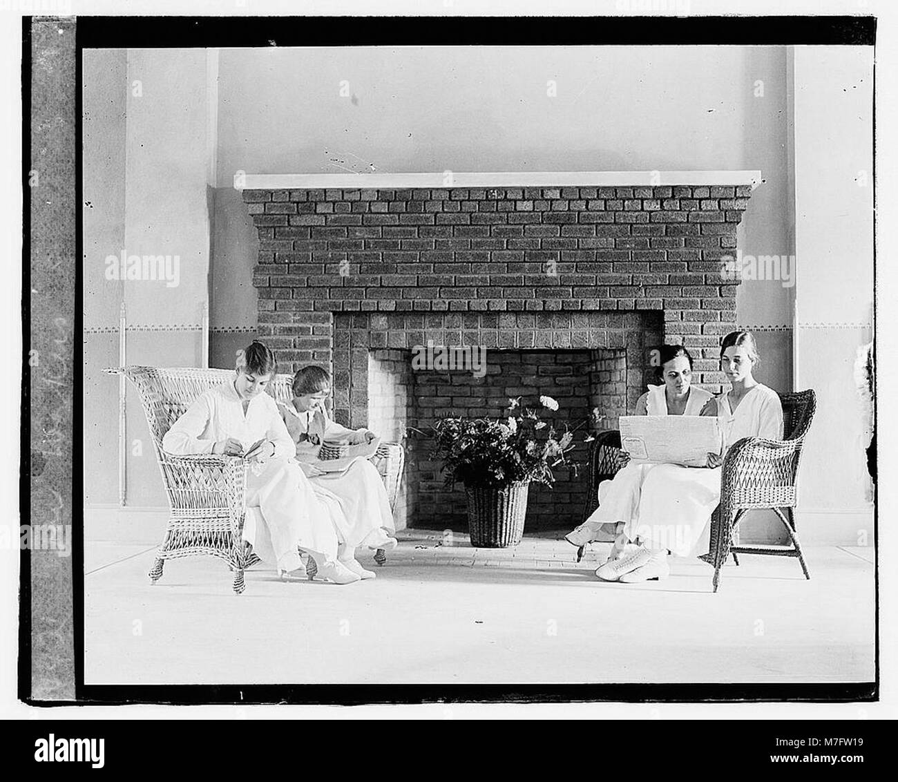 A photograph of workers involved in wartime efforts, likely during ...
