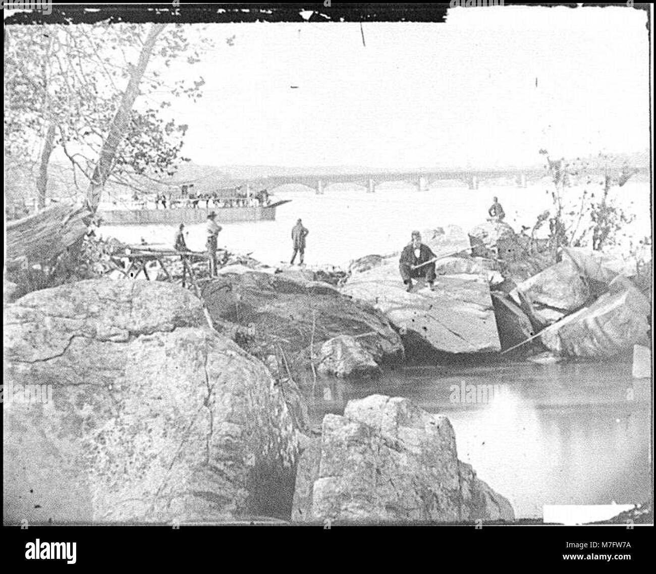 A photograph of a Georgetown ferry-boat transporting wagons, with the ...
