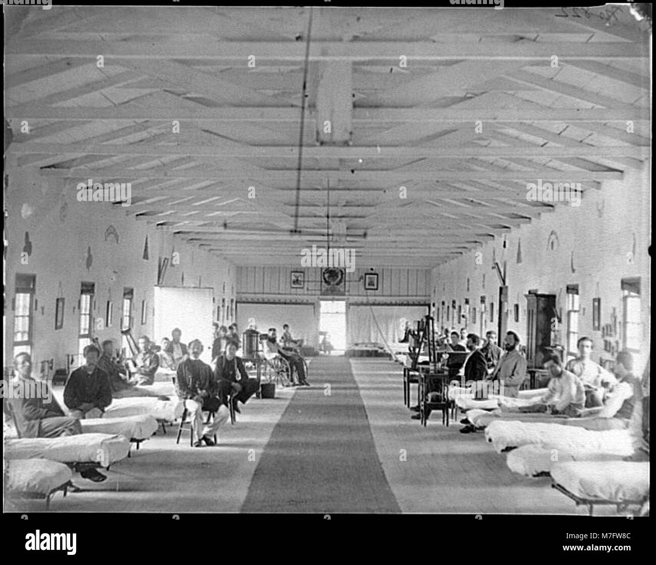 A historical photograph showing patients in Ward K of the Armory Square ...