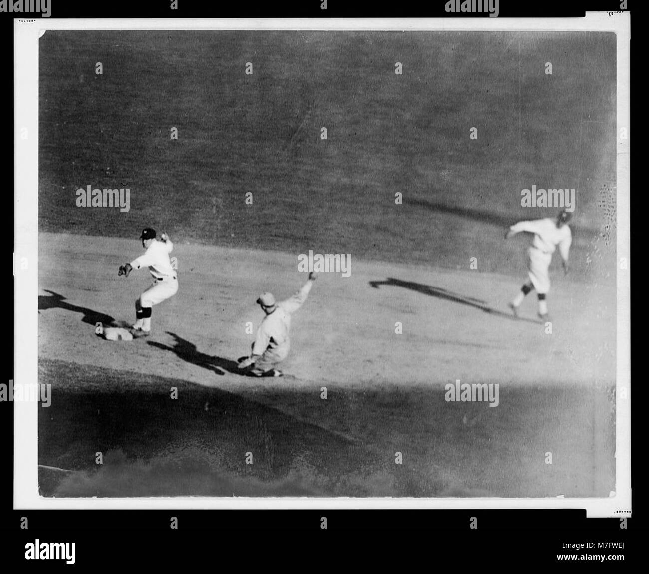 A baseball player from Washington tags second base, narrowly ahead of a ...