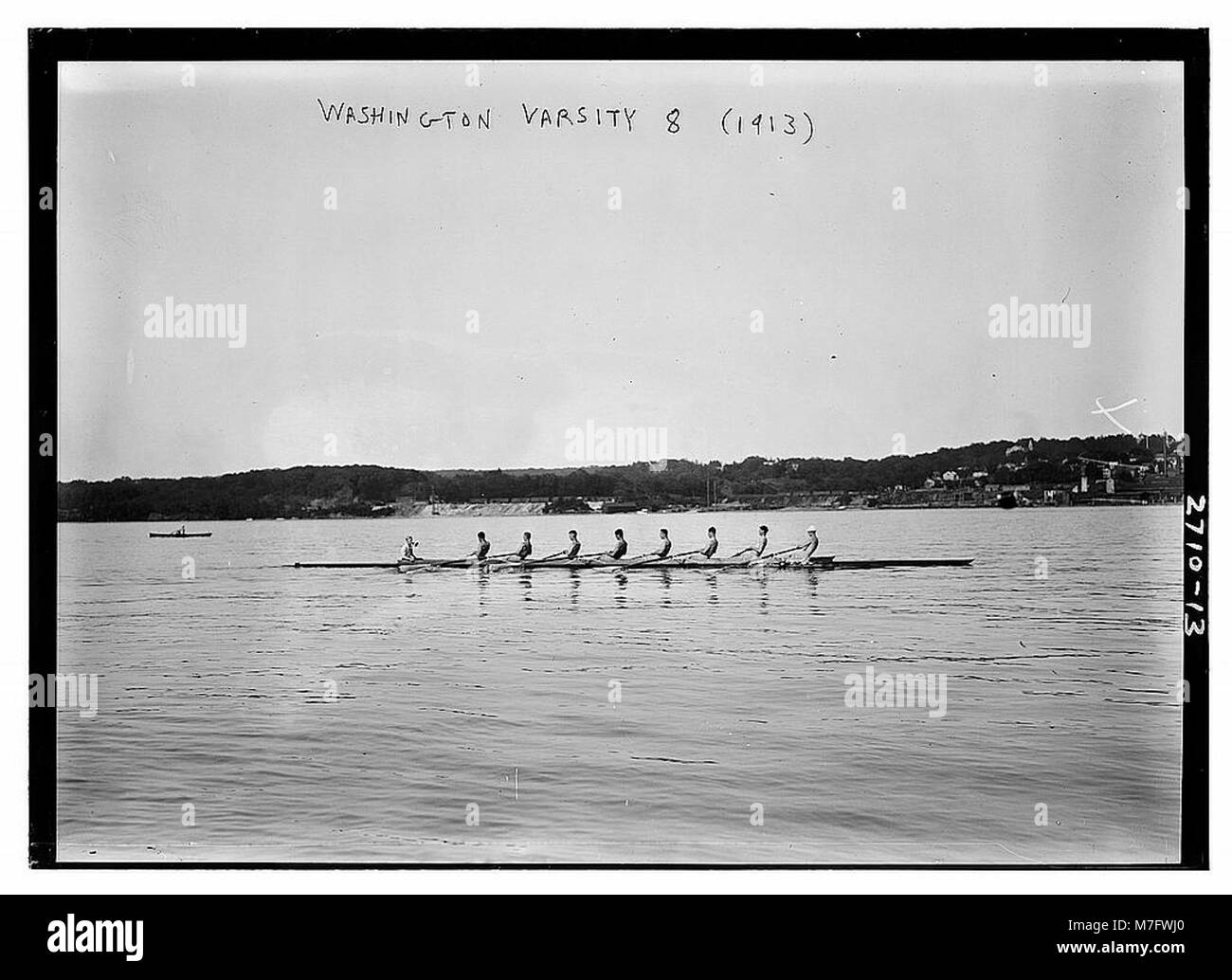 The photo captures the Washington Varsity 8 rowing team from 1913. It ...