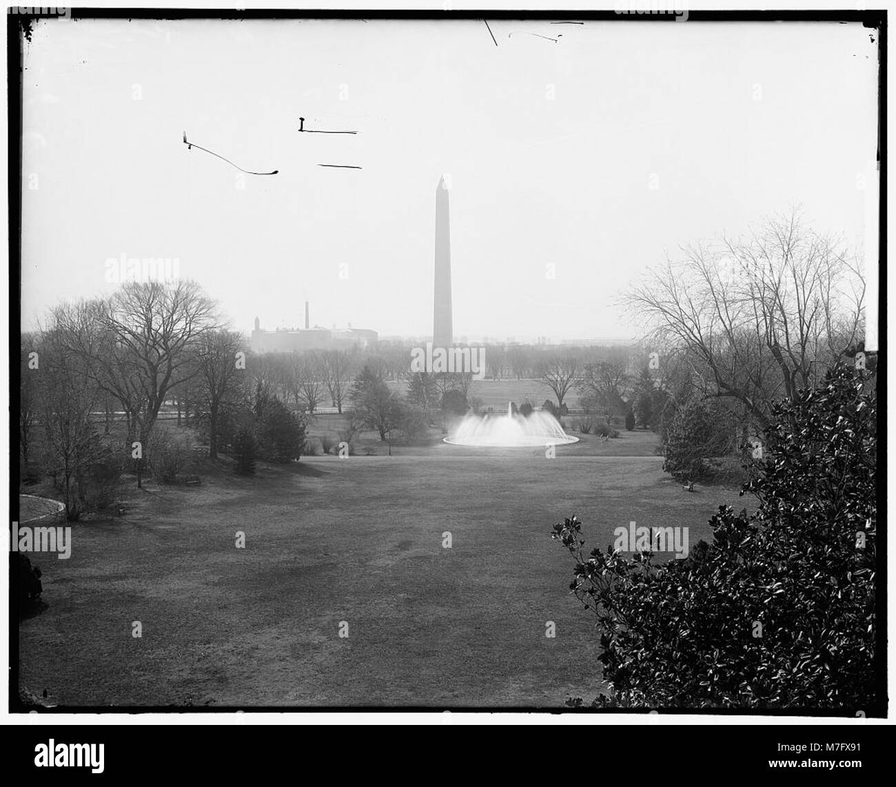 This photograph shows the grounds of the White House, with a view ...