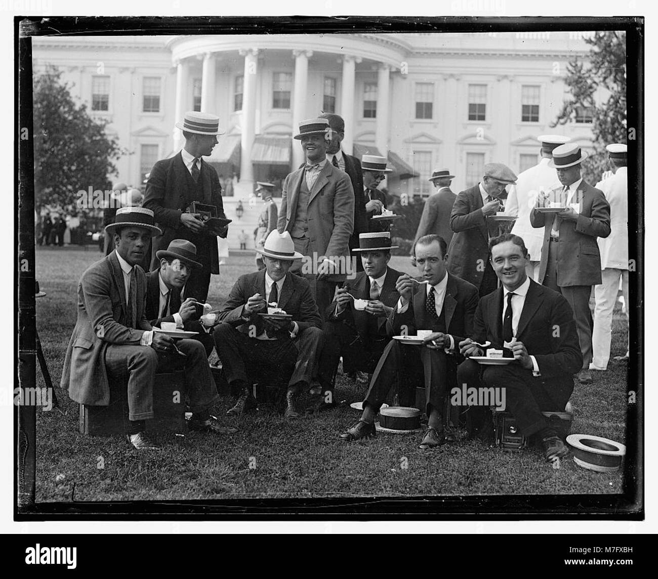 This image features photographers at work within the White House ...
