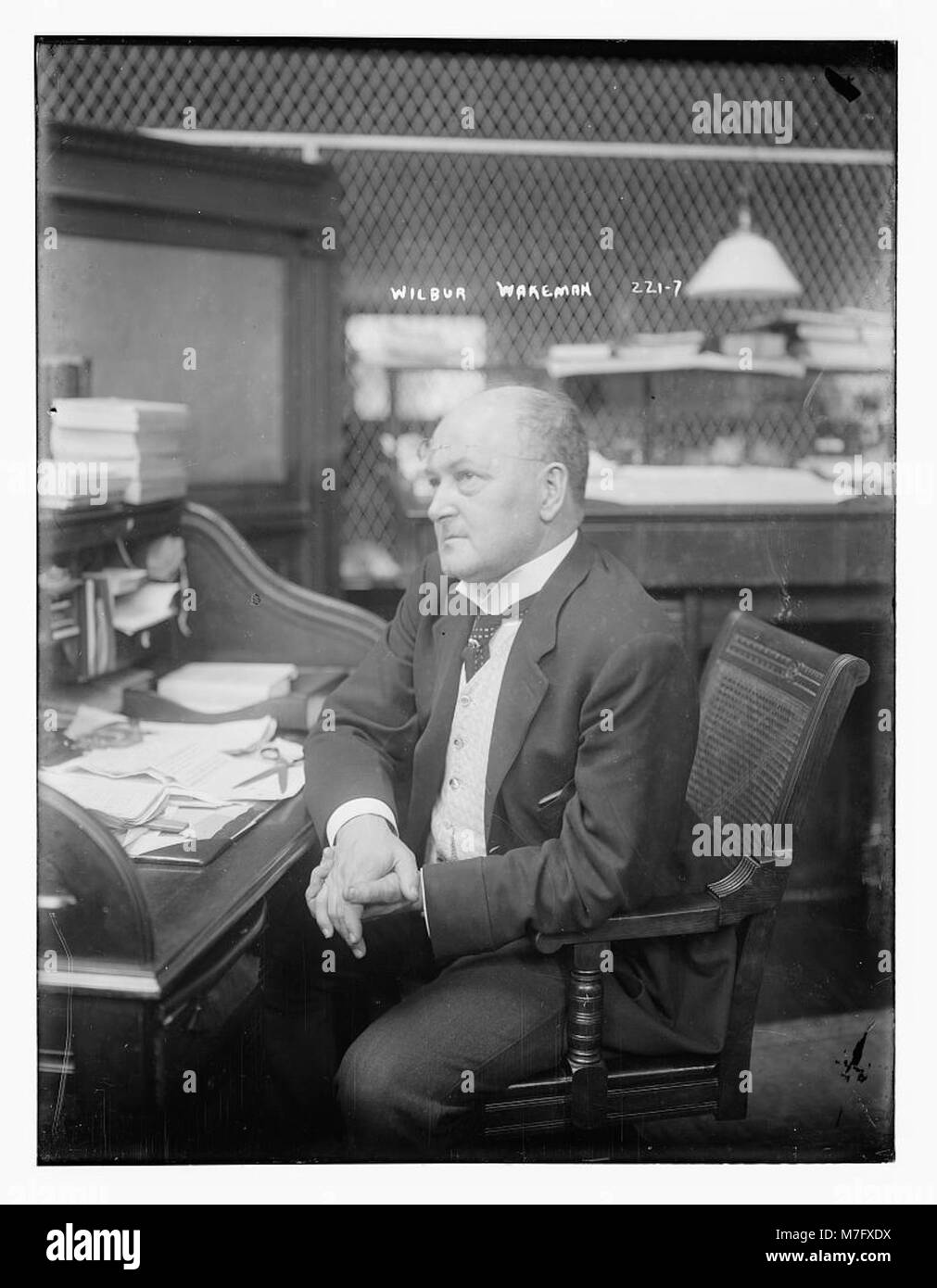 A portrait of Wilbur Wakeman, captured in a formal pose. This ...