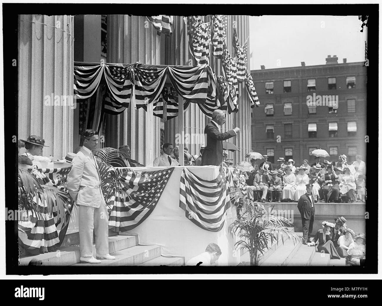 A historical photograph of President Woodrow Wilson speaking, capturing ...