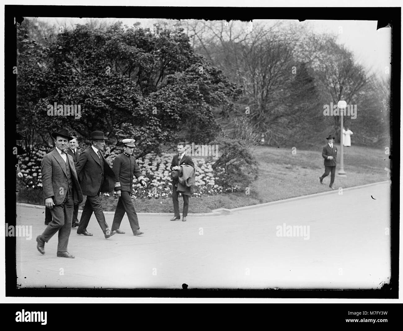 A photograph of President Woodrow Wilson walking, capturing a candid ...
