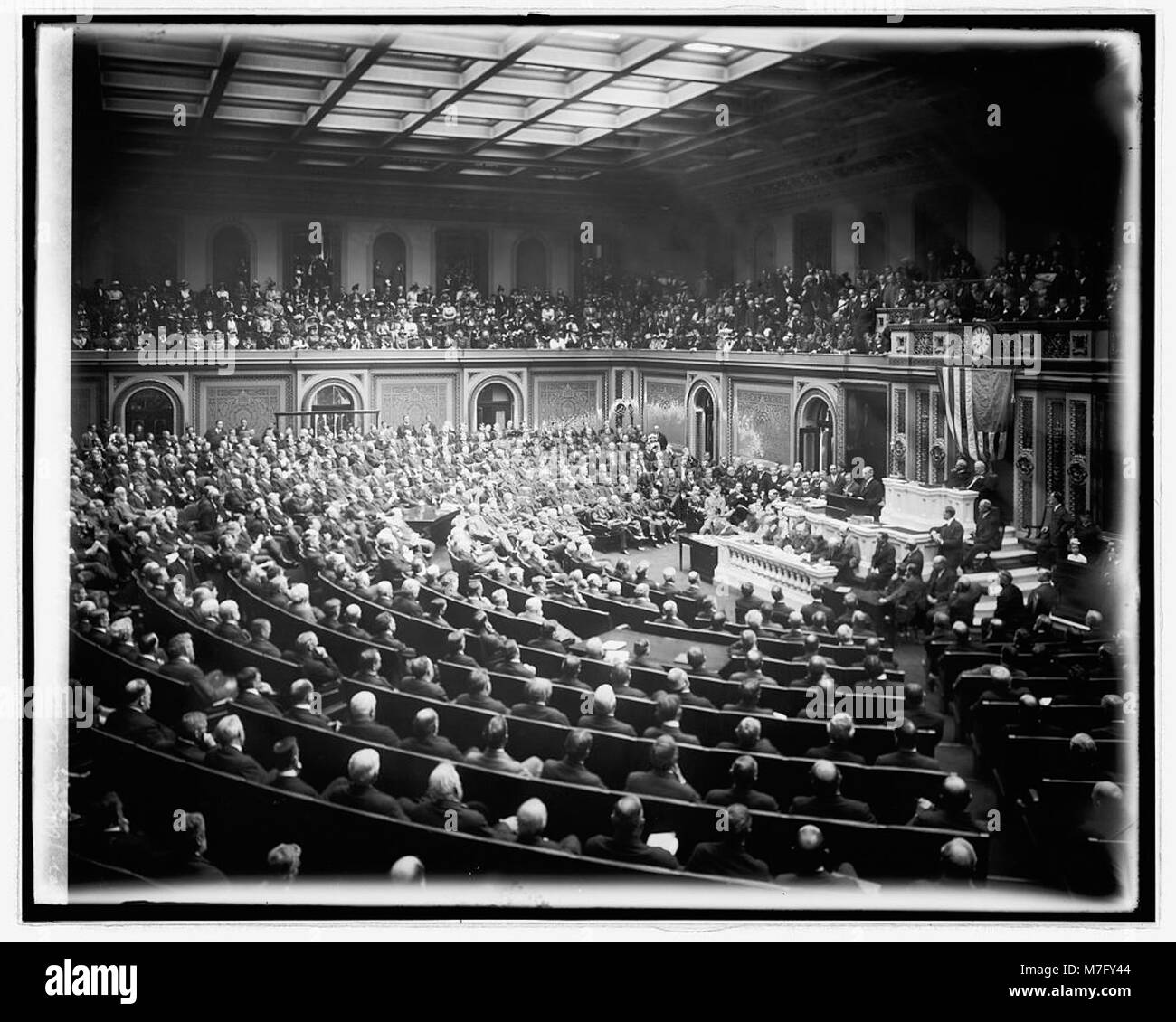 A photograph of President Woodrow Wilson addressing Congress during the ...