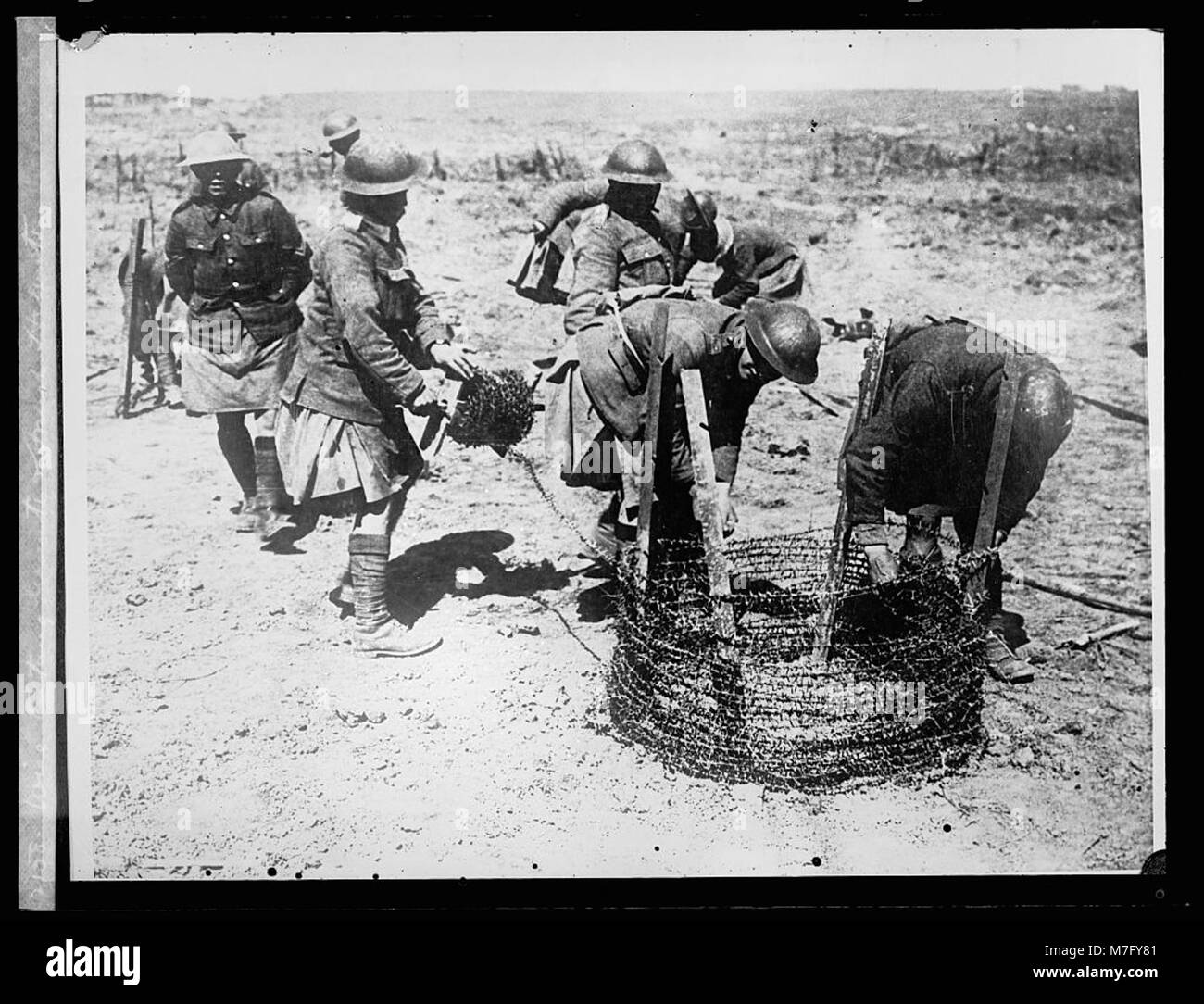 Photograph of military wire entanglements paired with French and ...