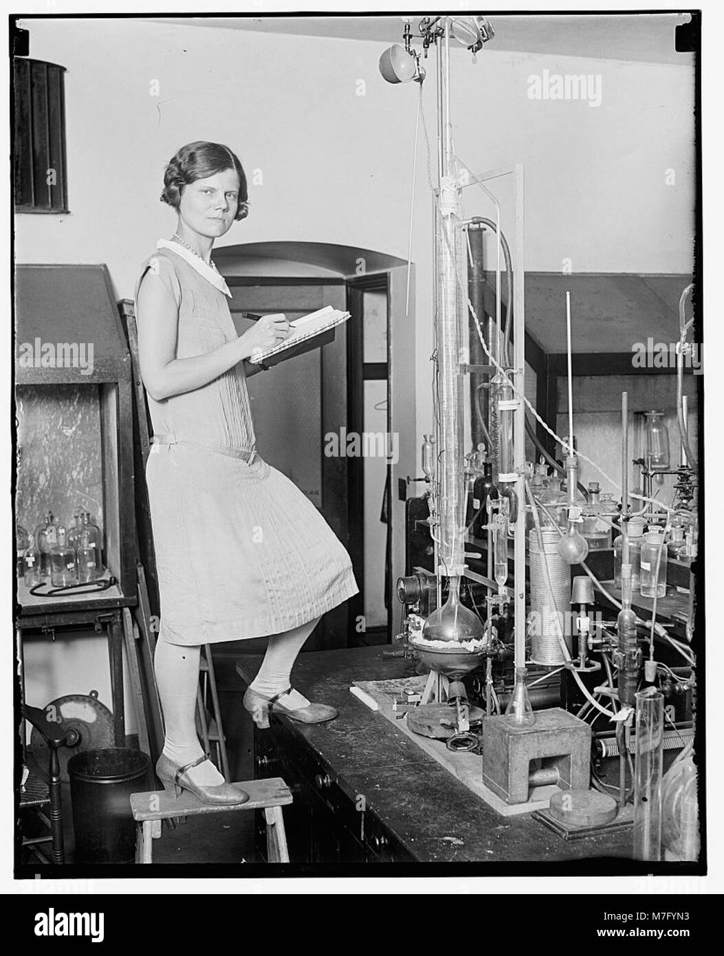 This image features a woman scientist, reflecting her role and ...