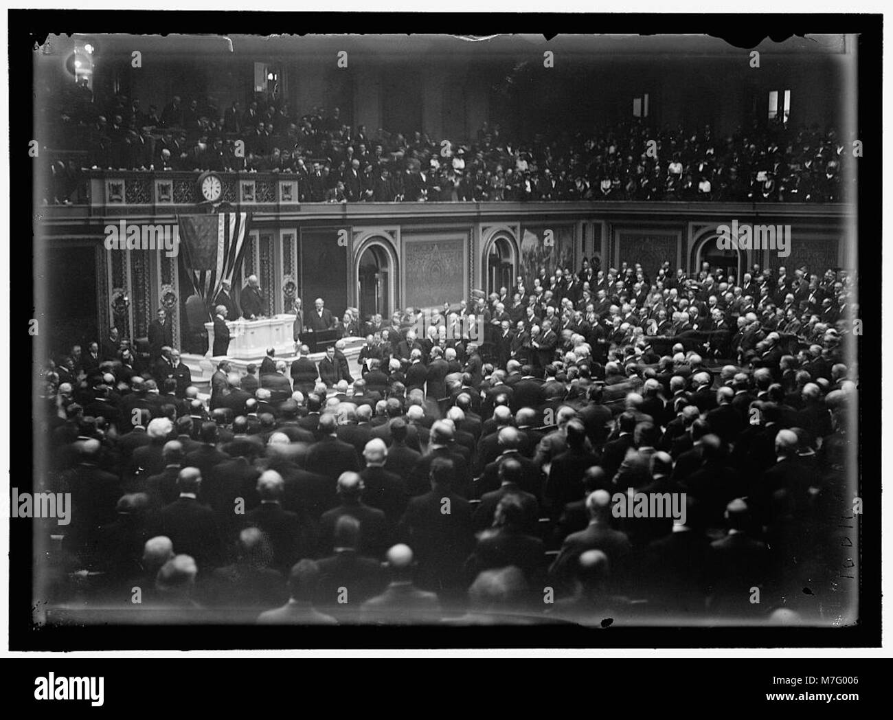 A photograph of President Woodrow Wilson addressing Congress, capturing ...