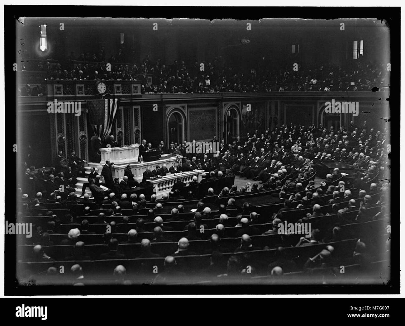 A portrait of President Woodrow Wilson addressing Congress, showcasing ...