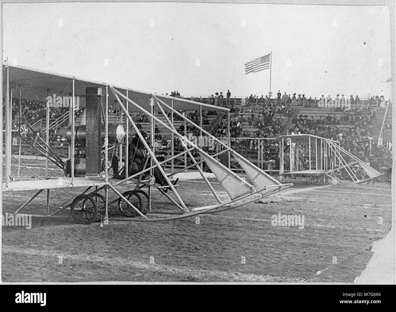 A Wright aeroplane is shown on the starting track, ready for takeoff ...