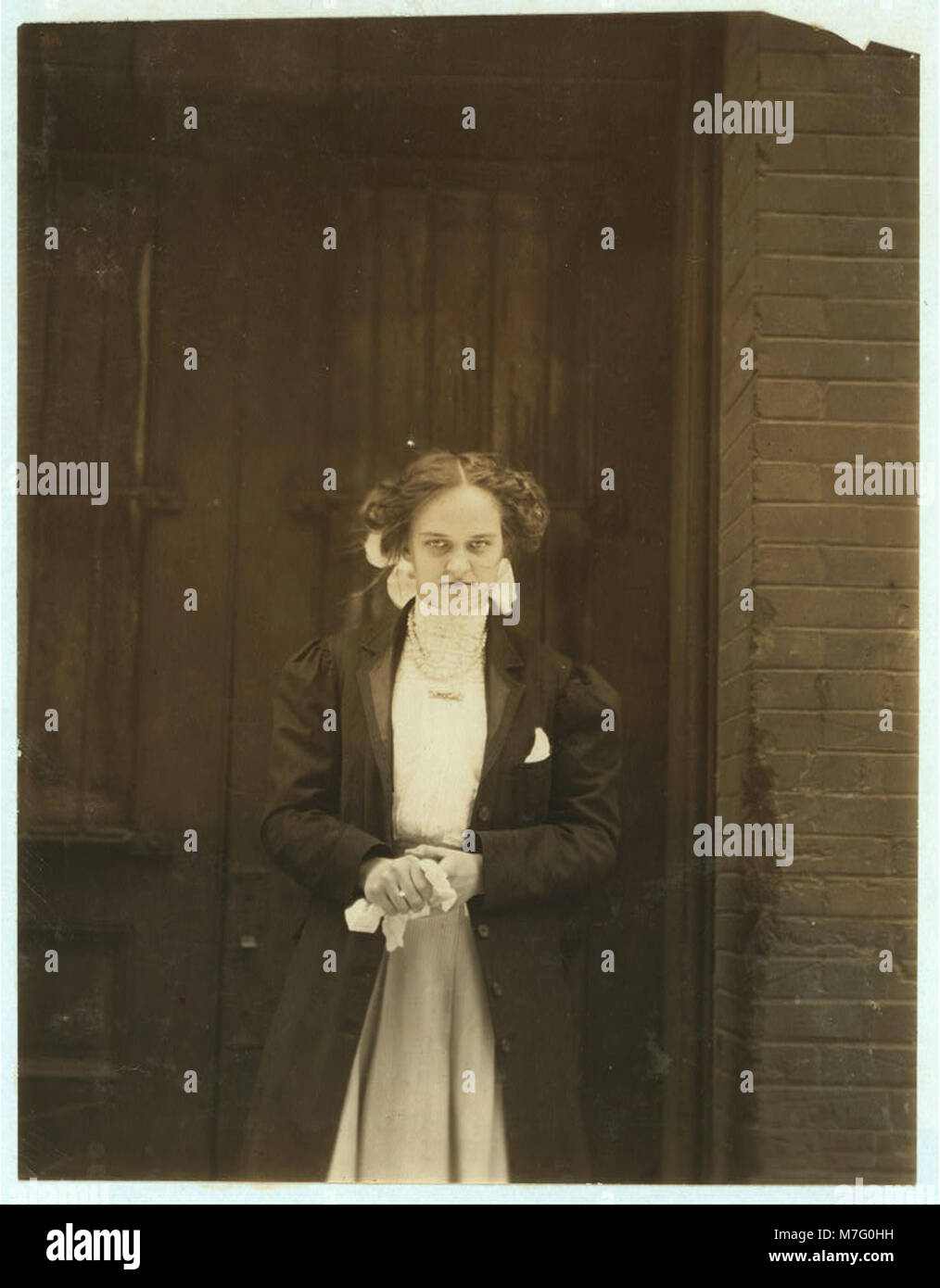 A young girl is shown working long hours at the Inland Type Foundry, an ...