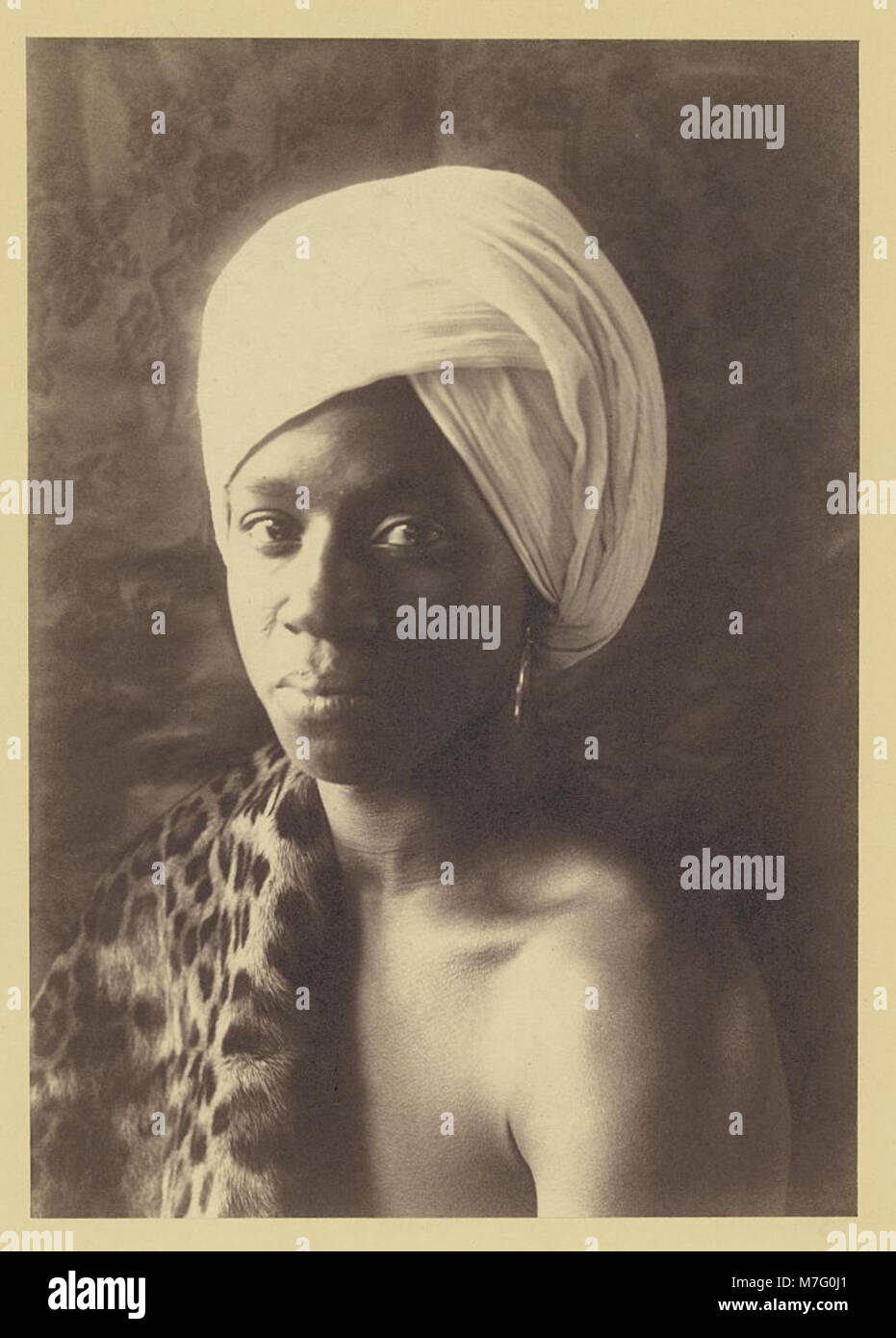 A young man is depicted wearing traditional African attire, including a ...