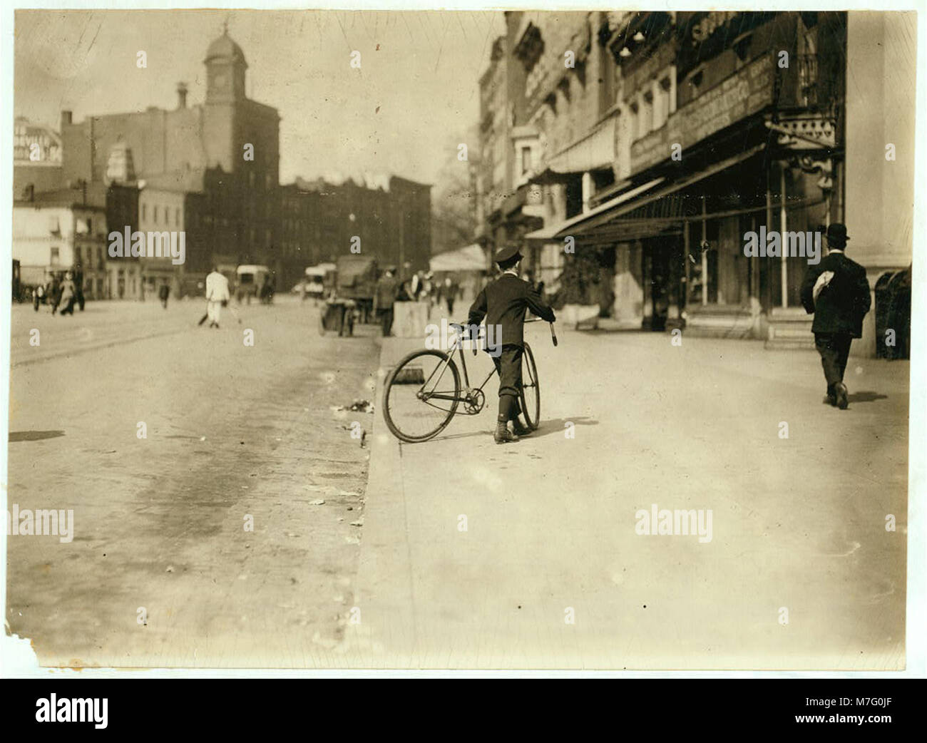 A photograph depicting a young messenger delivering a message in an ...