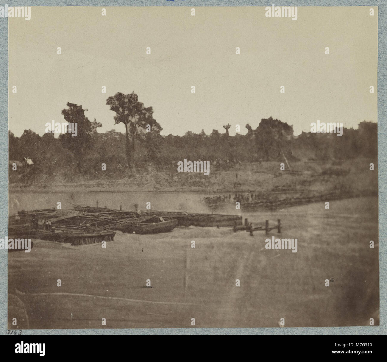 A historic photograph showing the construction of the Red River Dam ...