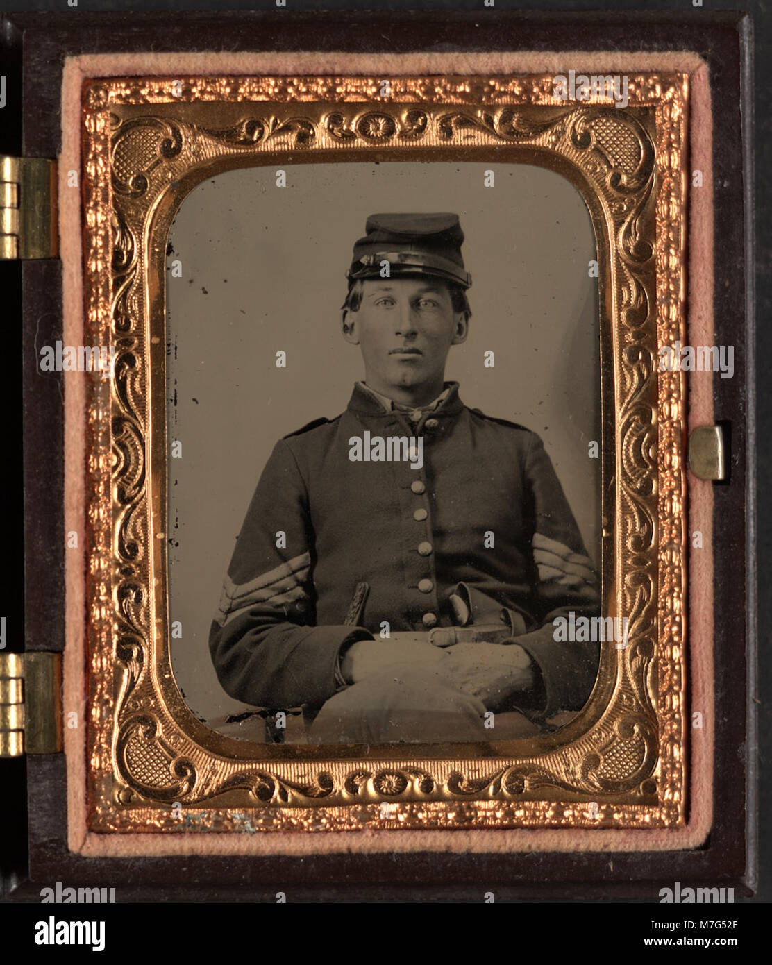 A portrait of an unidentified soldier wearing a Union sergeant's ...