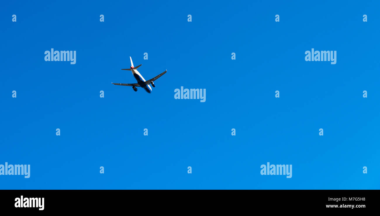 Passenger plane flying in the blue sky, cruise aircraft, transport ...