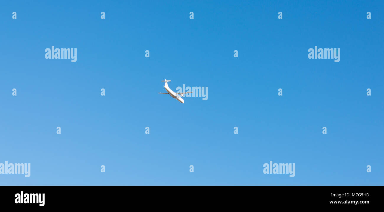 Passenger plane flying in the blue sky, cruise aircraft, transport ...