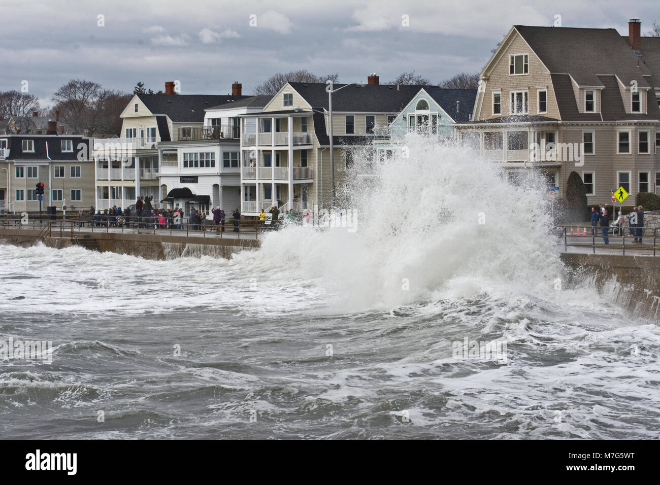 Single wave causing a big splash over the railings and seawall Stock ...