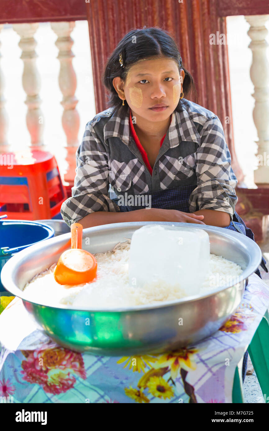 daily life in Myanmar - Young Burmese woman with big bowl of rice for ...