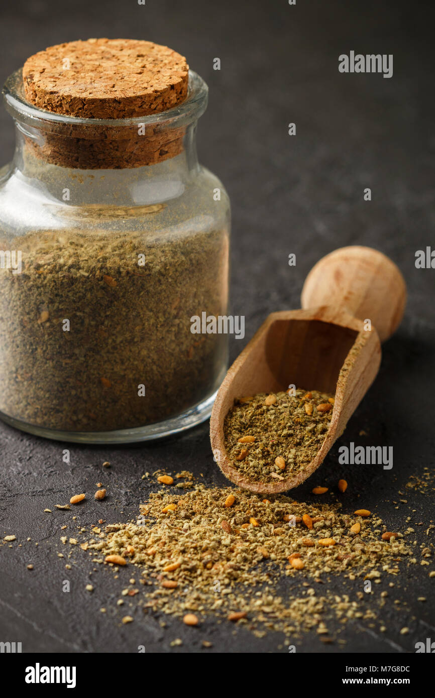 Zaatar - mix of Oriental spices on a dark stone background. Seasoning ...