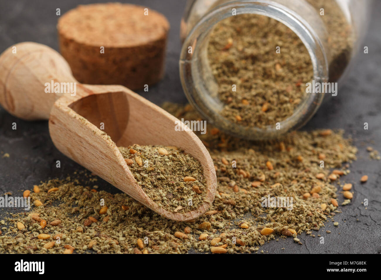 Zaatar - mix of Oriental spices on a dark stone background. Seasoning ...