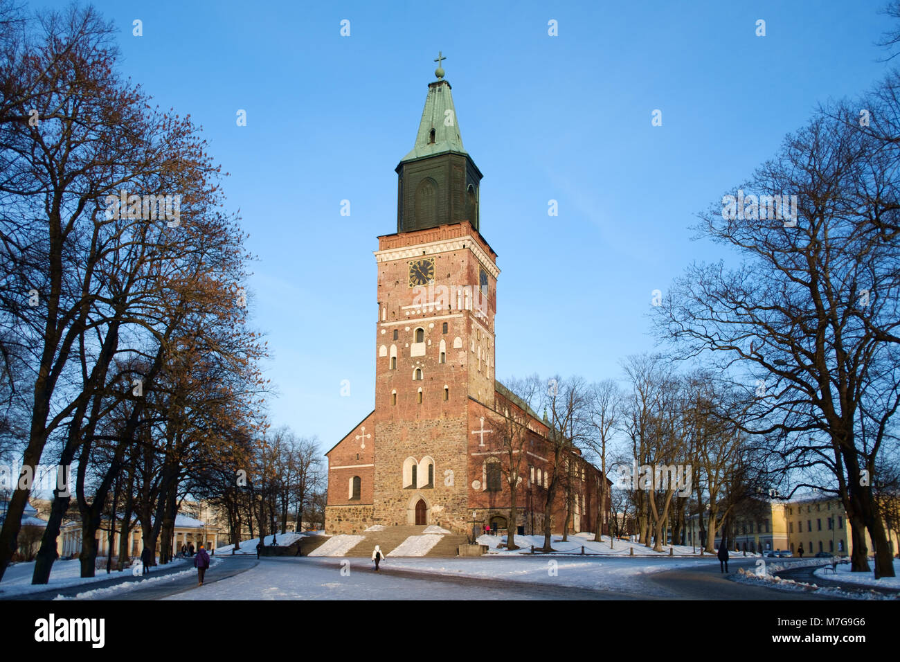 Turku Cathedral in winter in sunlight, surrounded by trees Stock Photo ...