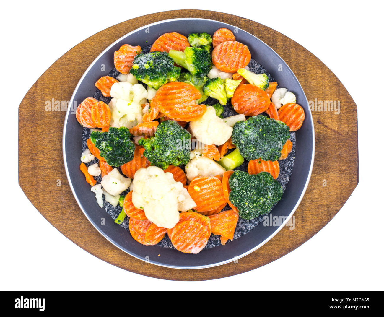 Frying pan with frozen vegetables Stock Photo - Alamy