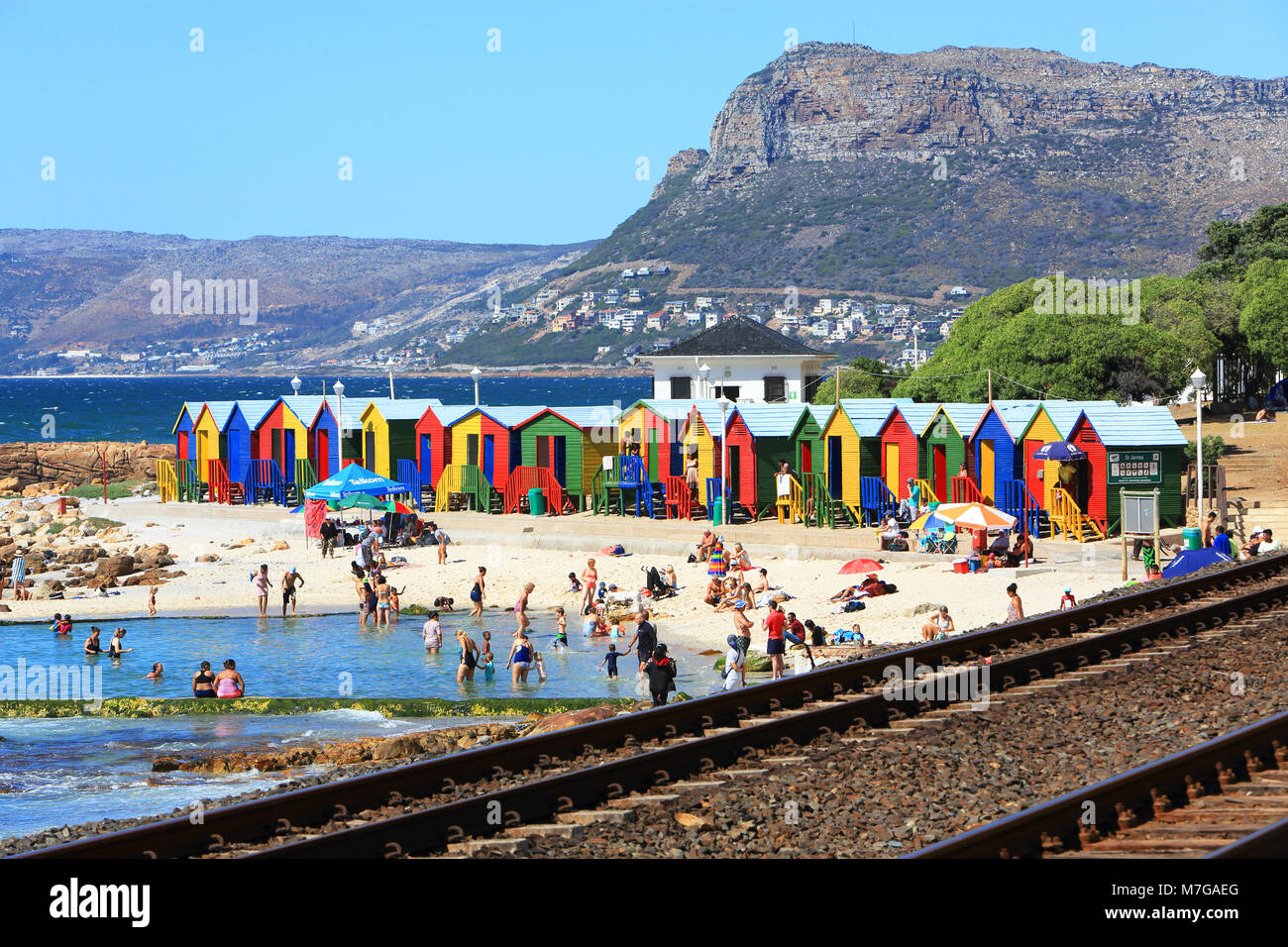 Colourful beach huts by the small sheltered St James Beach, near Kalk ...