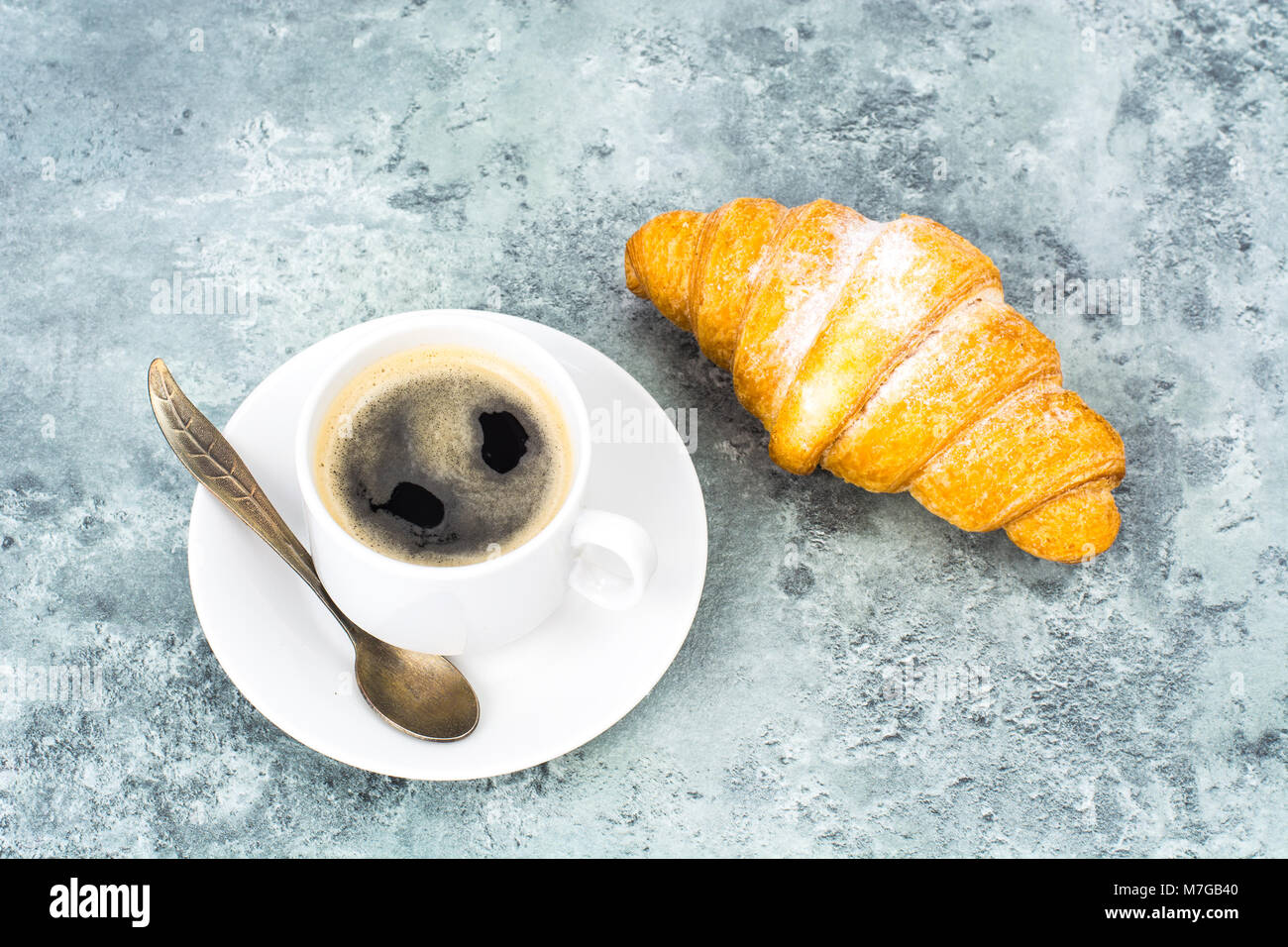 Aromatic hot coffee with croissant for breakfast. Studio Photo Stock ...