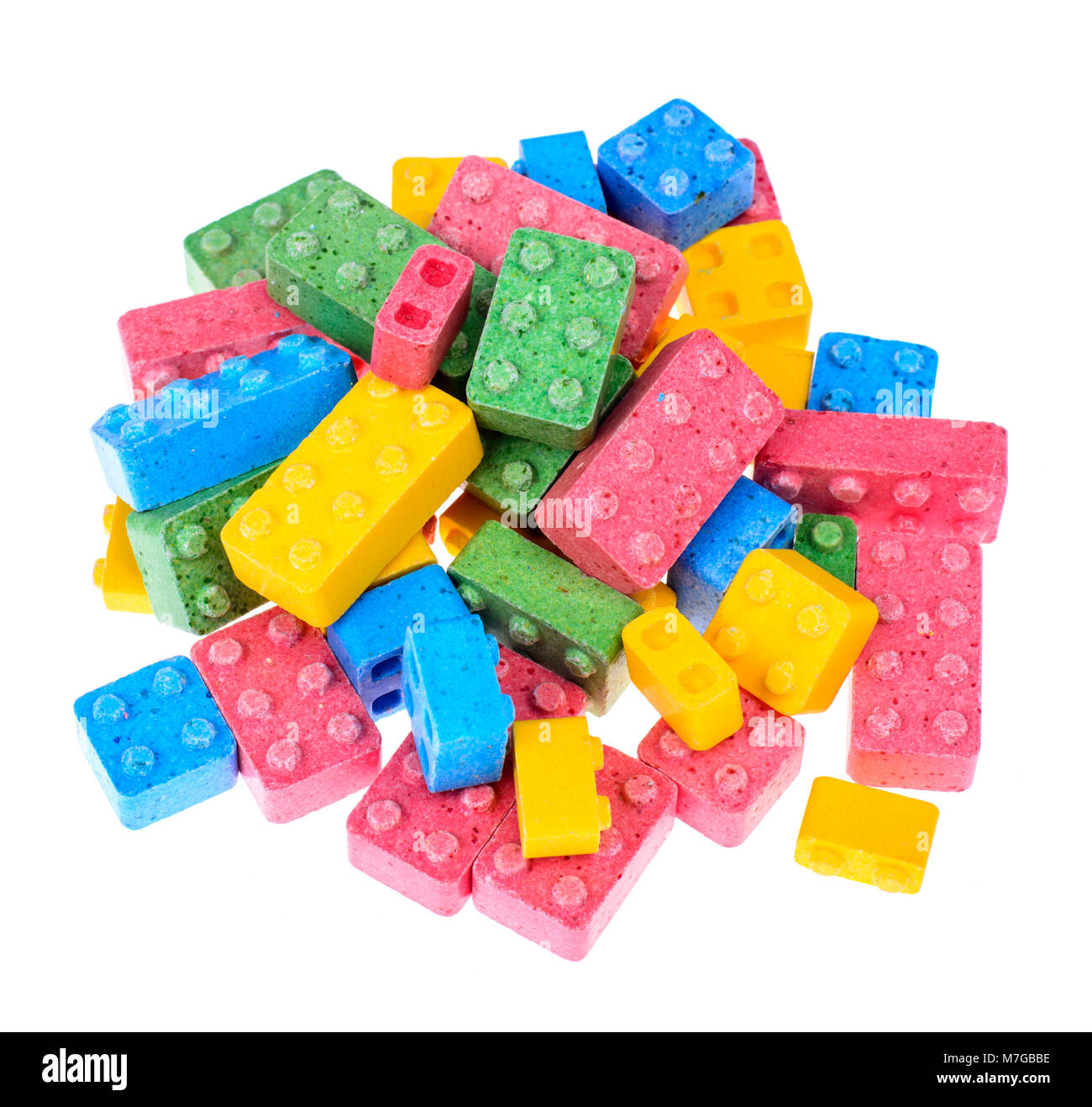 Colored chewing sweets in form of children's designer Stock Photo - Alamy