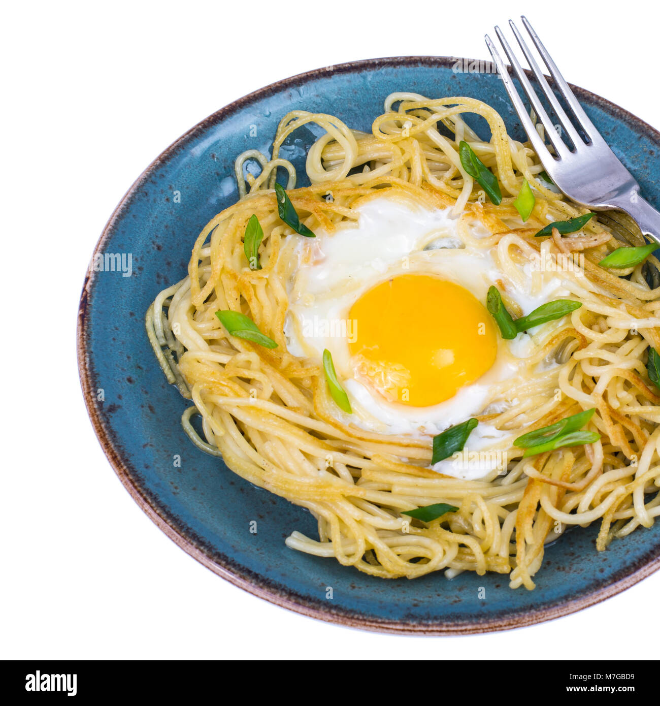 Blue plate with spaghetti, fried egg on white background Stock Photo ...